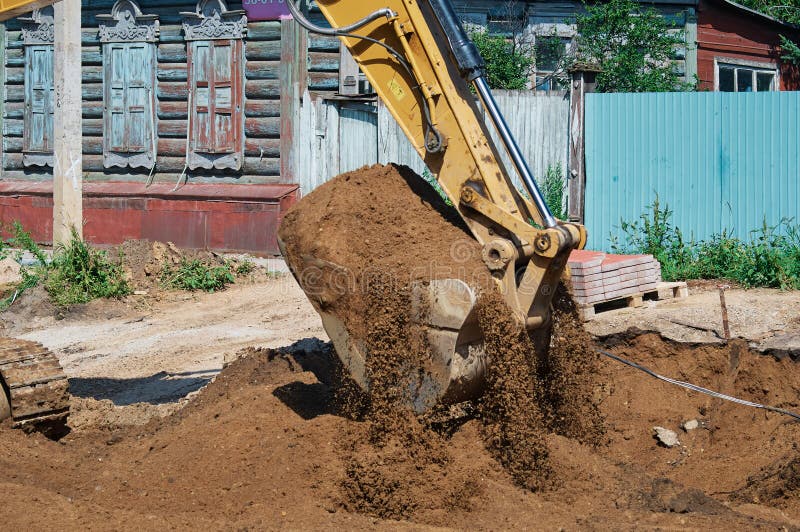 Close Up View of an Excavator Bucket Full of Earth. the Process of ...