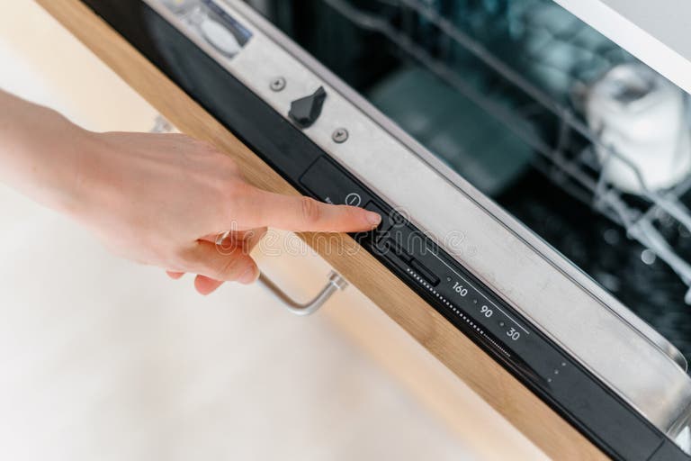 Choosing Eco Mode Program on the Control Panel of Dishwasher Stock ...
