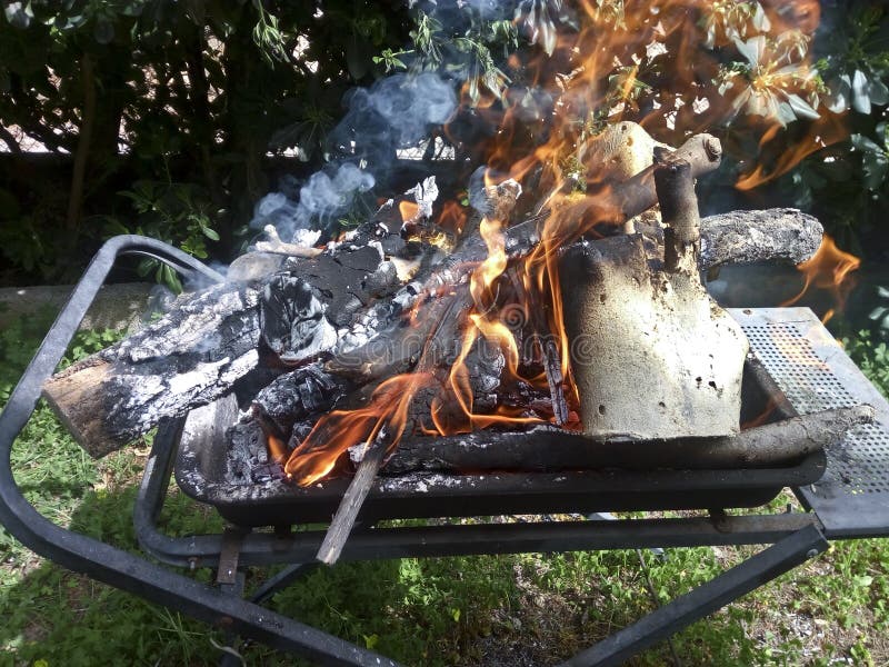 Preparing fire for a BBQ stock image. Image of wood - 113557971