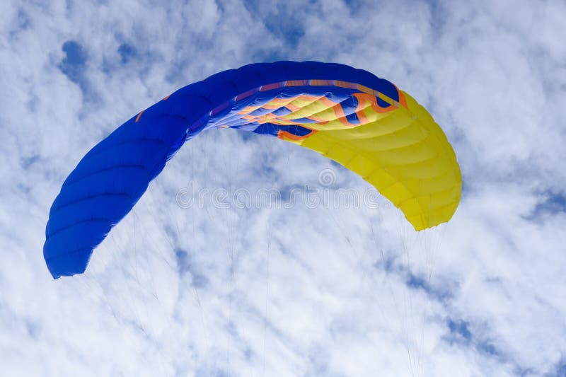 View of a Flying Colored Parachute for Snowkiting Against a Bright Sky ...