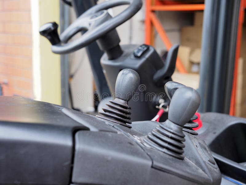 Close-up View of Forklift Controls Showcasing Levers and Steering Wheel ...