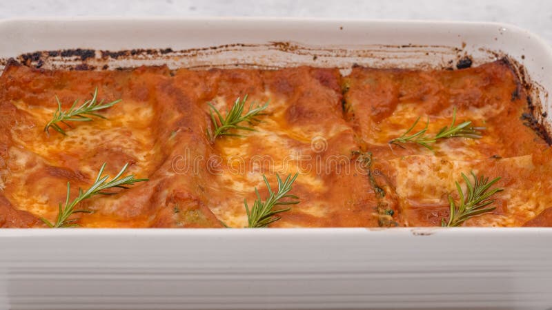 Close Up View of Fresh Baked Spinach Lasagna with Rosemary Topping ...