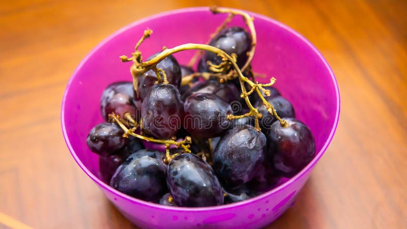 Close Up View of the Fresh Grapes in a Plastic Cup or Bowl Stock Photo ...