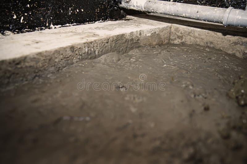 Wet Cement Spreading on a Construction Floor Surface Close-up Stock ...