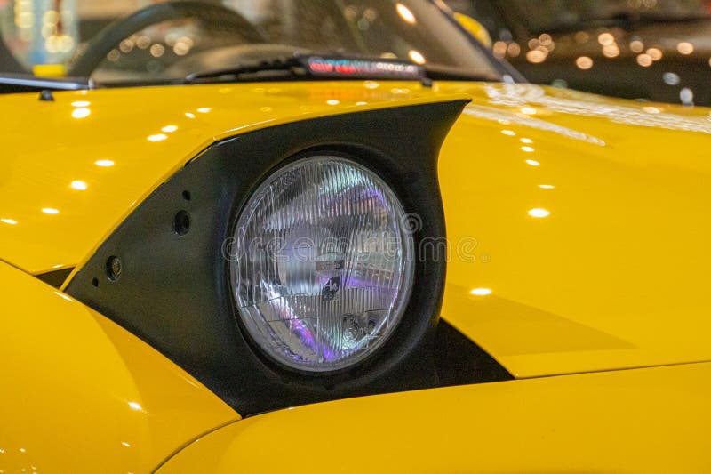 A Close-up View of the Front Section of a Yellow Racing Car Shows the ...