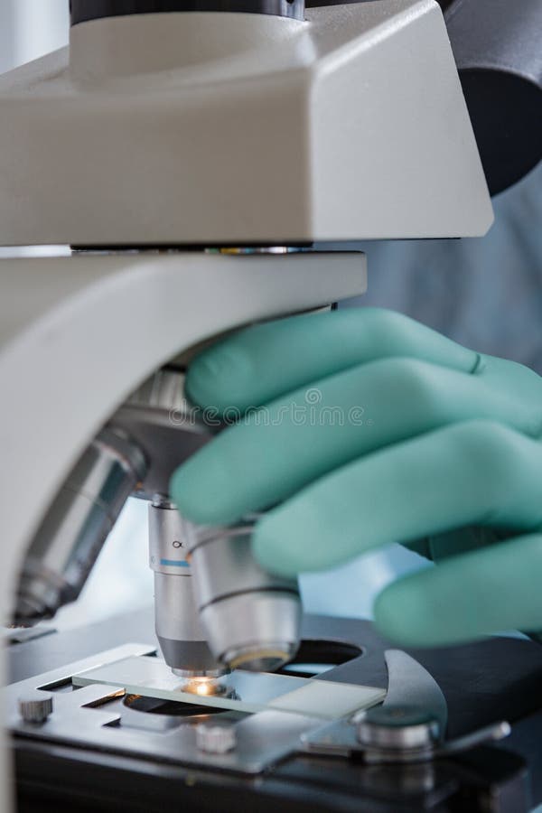 Close Up View of Glass Under Microscope Stock Photo - Image of hands ...