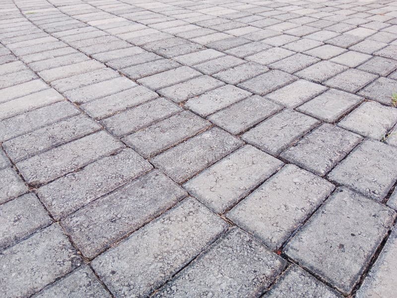 A Close-up View of Gray Interlocking Paving Bricks Forming a Patterned ...