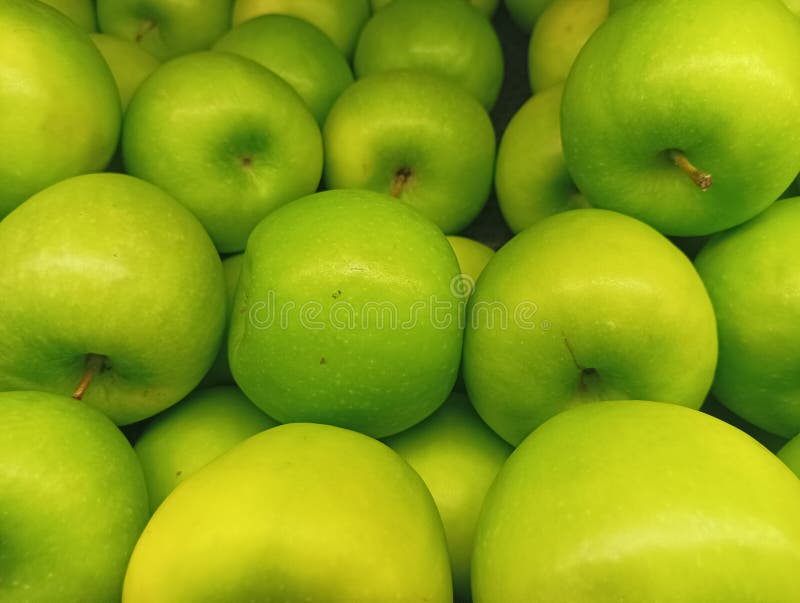 A Close-Up View of Green Apples in a Pile Stock Image - Image of store ...