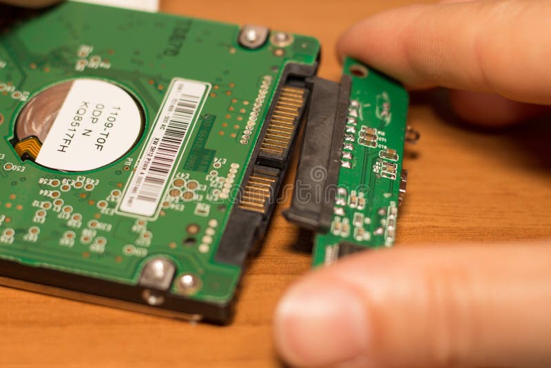 Close-up View of Hands Connecting an Internal Hard Drive of a Notebook ...