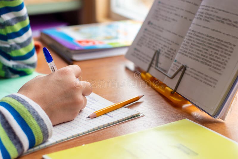 Close-up View of the Hands of a Schoolboy Doing Homework Stock Image ...