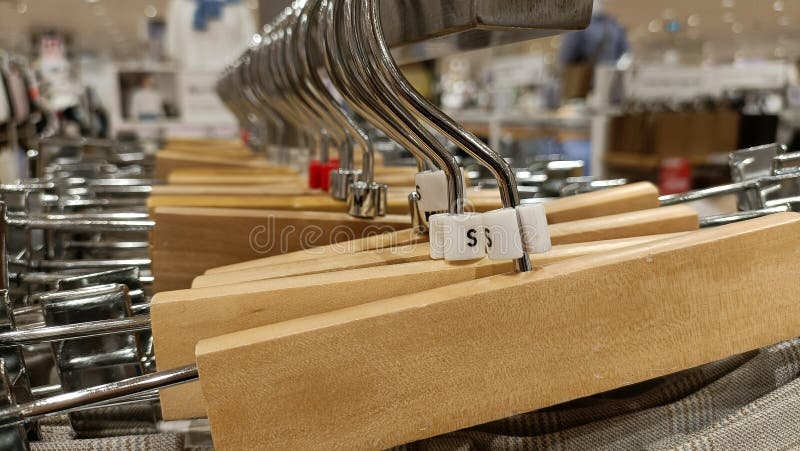 Close Up View of Hanging Clothes Arranged on a Display Rack Small Size ...