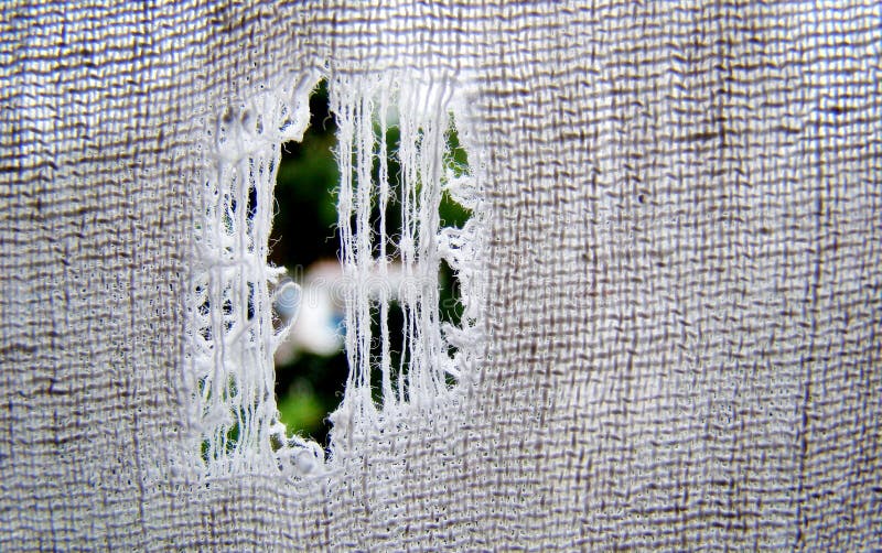 Hole in Textile or Cloth for Use As Background Stock Photo - Image of ...