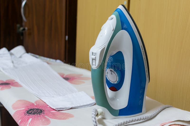 A Close Up View of an Iron Box Kept on an Ironing Table for Ironing ...