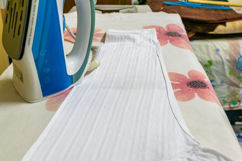 A Close Up View of an Iron Box Kept on an Ironing Table for Ironing ...