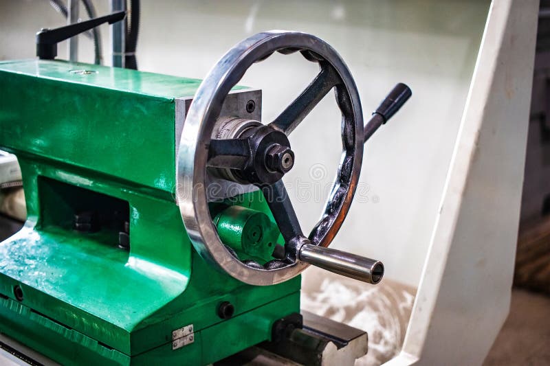A Close-up View of a Lathe Machine in a Factory Setting, Highlighting ...