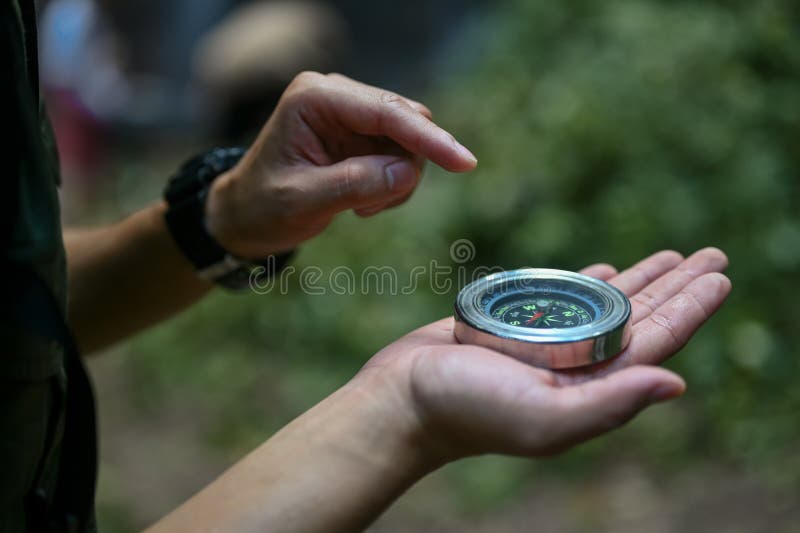 Close Up View of Male Hiker Using Compass for Directions while ...