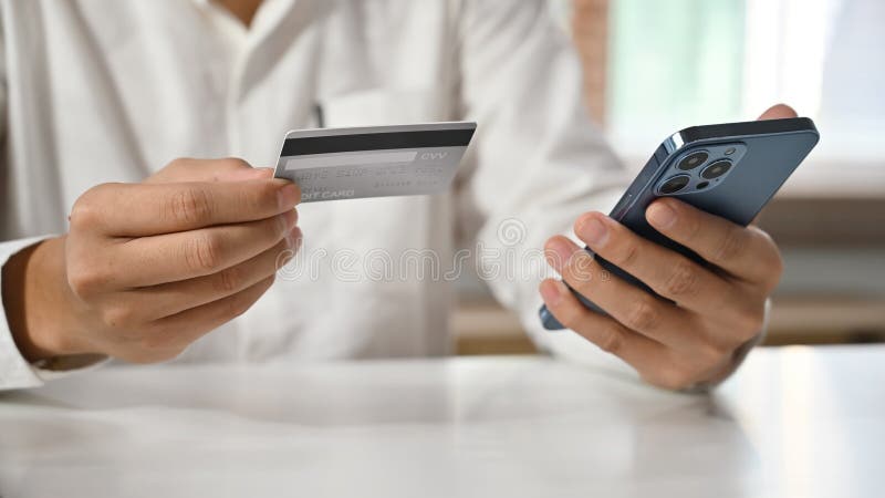 Close Up View of Man Hand Holding Credit Card Making Transaction Using ...