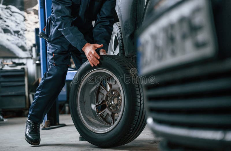 Close Up View of Man that is Moving Tire of the Car Stock Illustration ...