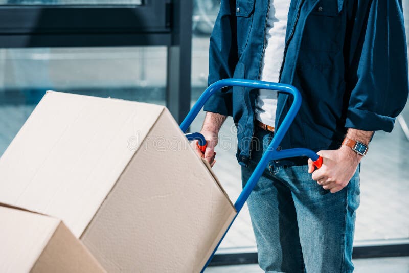 Close-up View of Man Pushing Hand Truck Stock Image - Image of working ...