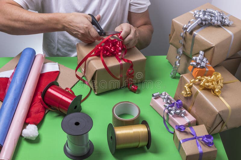 Close Up View of Man Wrapping Present Boxes. Stock Photo - Image of ...