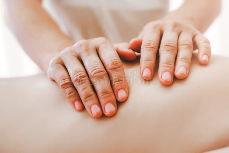 Close-up View Masseur Hands Doing Spin Massage. Selective Focus Stock ...