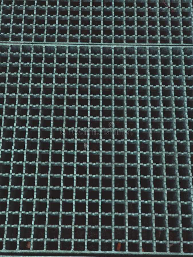 A Close-up View of a Metal Grating with a Square Grid Pattern. Stock ...