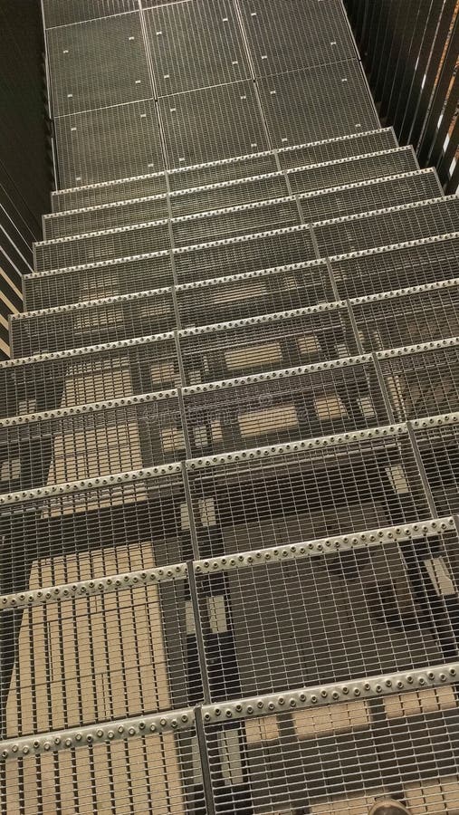 A Close-up View of a Metal Staircase with a Grid Pattern, Showing the ...