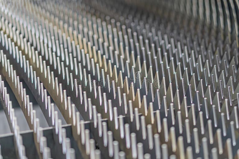 Close-up View of a Metallic, Grid-like Mechanical Structure in an ...