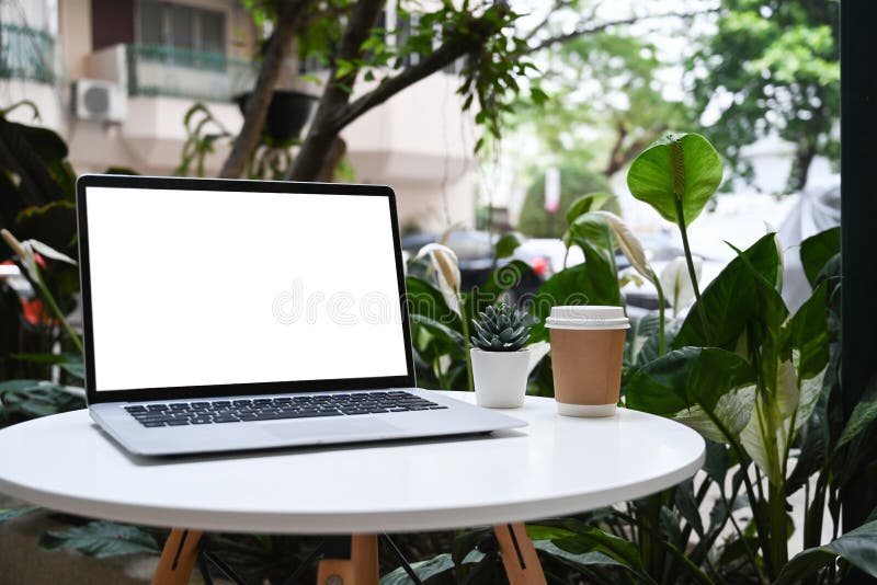 Mock Up Laptop Computer with White Screen on Round Table at Outdoor ...