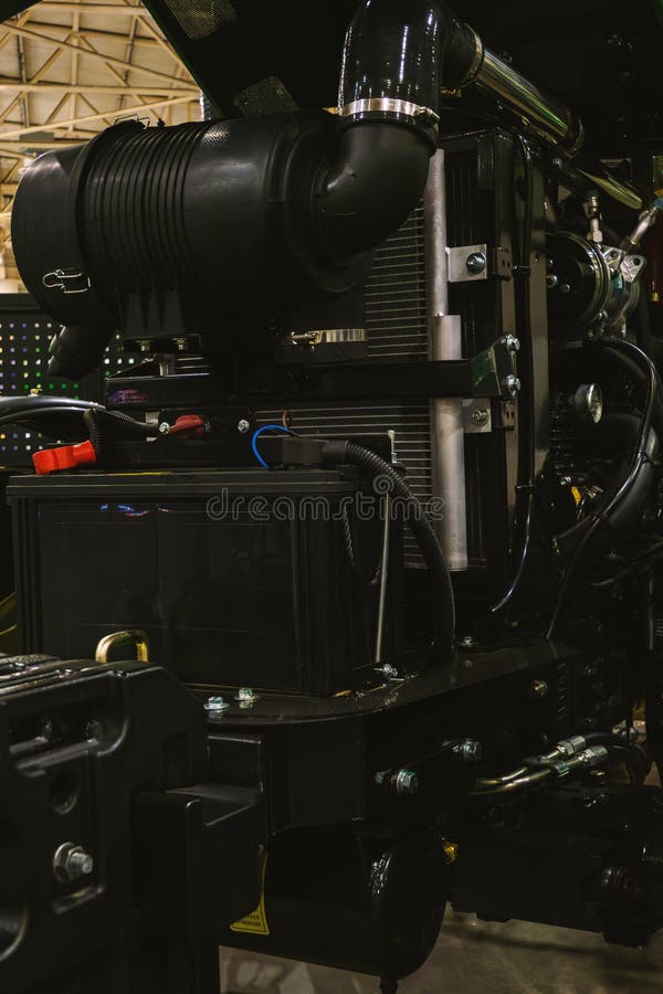 A Close-up View of a Modern Tractor with the Hood Open, Showcasing the ...