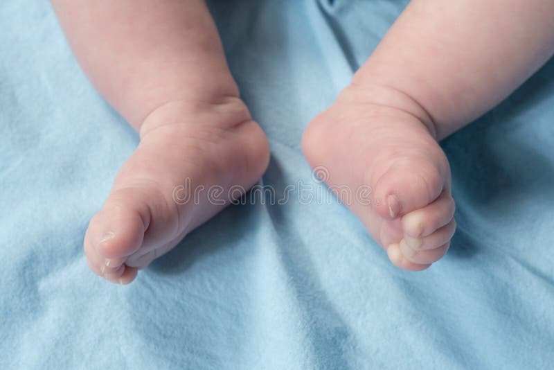 Close Up View of Newborn Baby Legs on a Bed Stock Image - Image of ...
