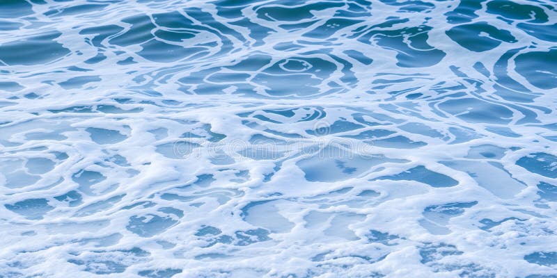 A Close Up View of Ocean Water with White Foam Creating Abstract ...