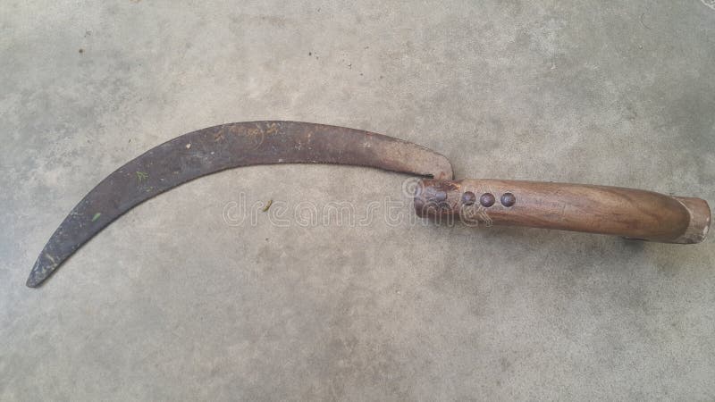 Close-up View of an Old Sickle & X28;reaping-hook& X29; on the Concrete ...
