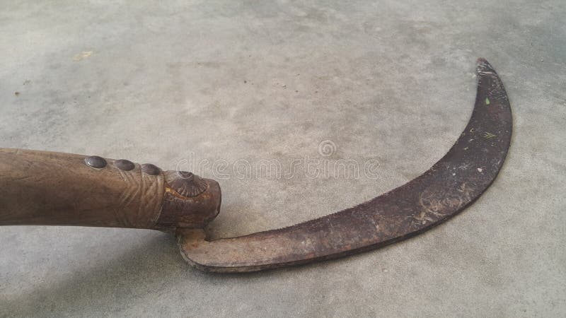 Close-up View of an Old Sickle & X28;reaping-hook& X29; on the Concrete ...