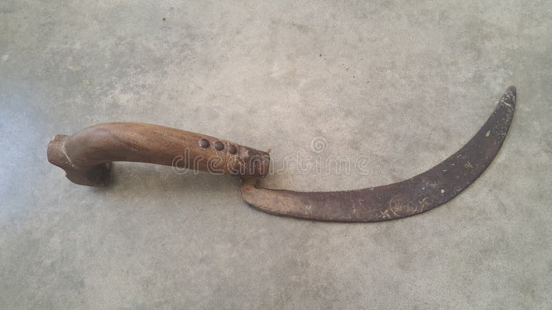 Close-up View of an Old Sickle & X28;reaping-hook& X29; on the Concrete ...