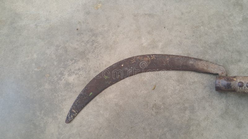 Close-up View of an Old Sickle & X28;reaping-hook& X29; on the Concrete ...
