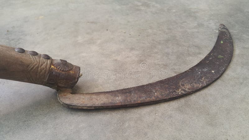 Close-up View of an Old Sickle & X28;reaping-hook& X29; on the Concrete ...