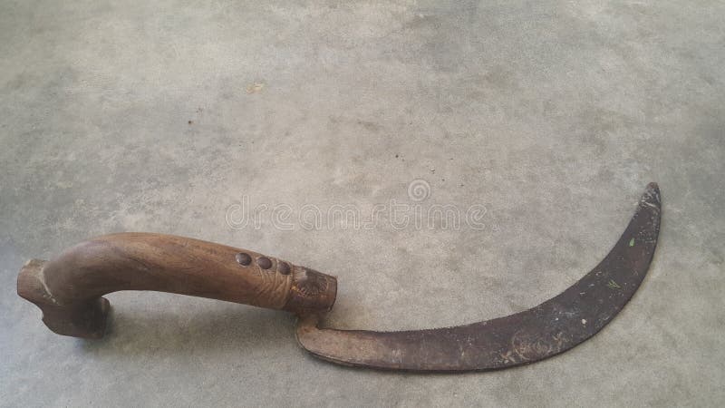 Close-up View of an Old Sickle Reaping-hook& X29; on the Concrete ...