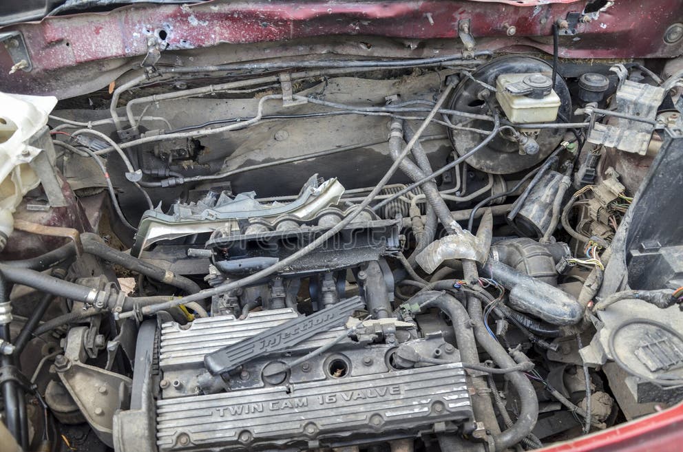 Close-up View of an Open Car Engine Compartment Showing a Disassembled ...