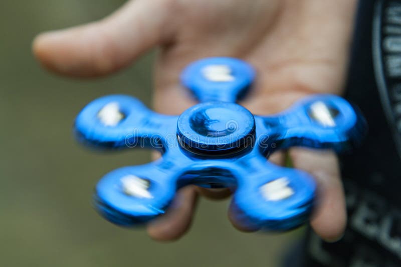 Close Up View of Palm of Boy on Which Blue Spinner is Spinning Stock ...