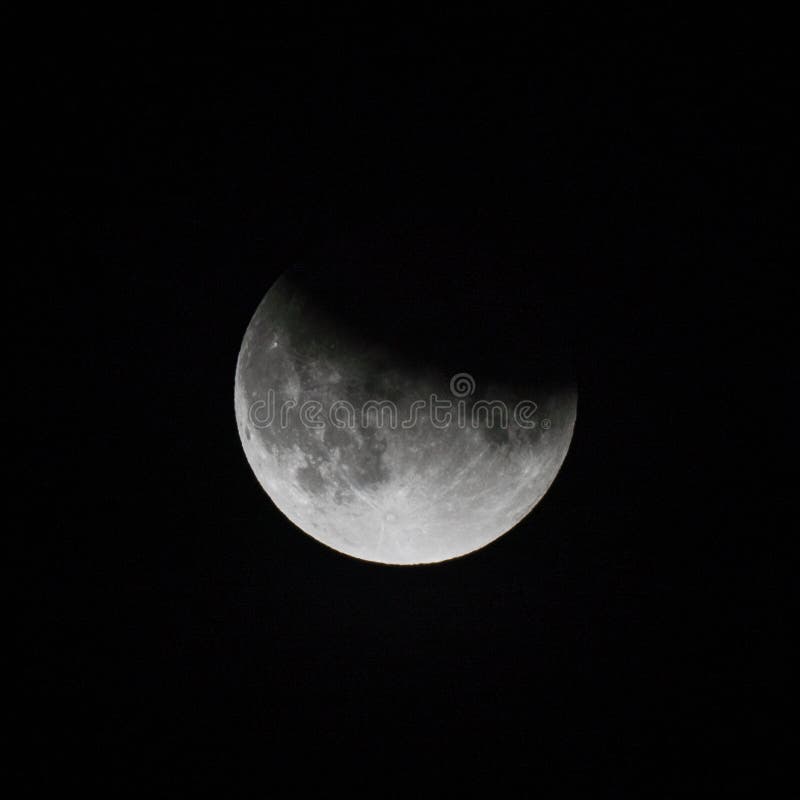 Close Up View of a Partial Lunar Eclipse in the Black Night Sky Stock ...