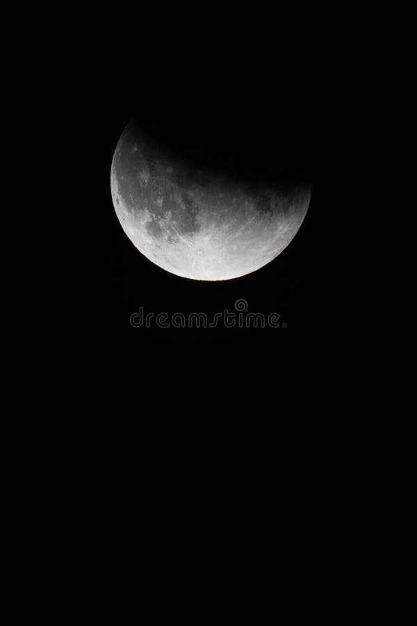 Close Up View of a Partial Lunar Eclipse in the Black Night Sky Stock ...