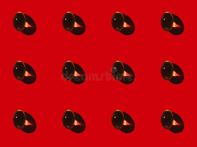 Close-up View of Pattern Made from Shiny Capsules on Red Stock Photo ...