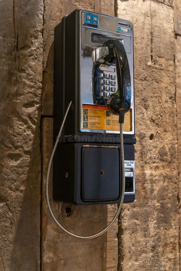 Close-up View of a Payphone on the Wooden Wall Stock Photo - Image of ...