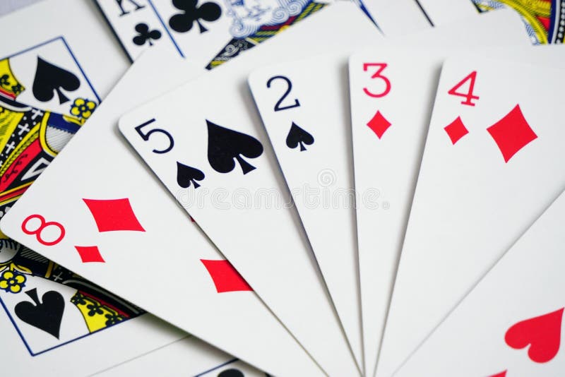 Close-up View of a Pile of Playing Cards Over the White Surface ...