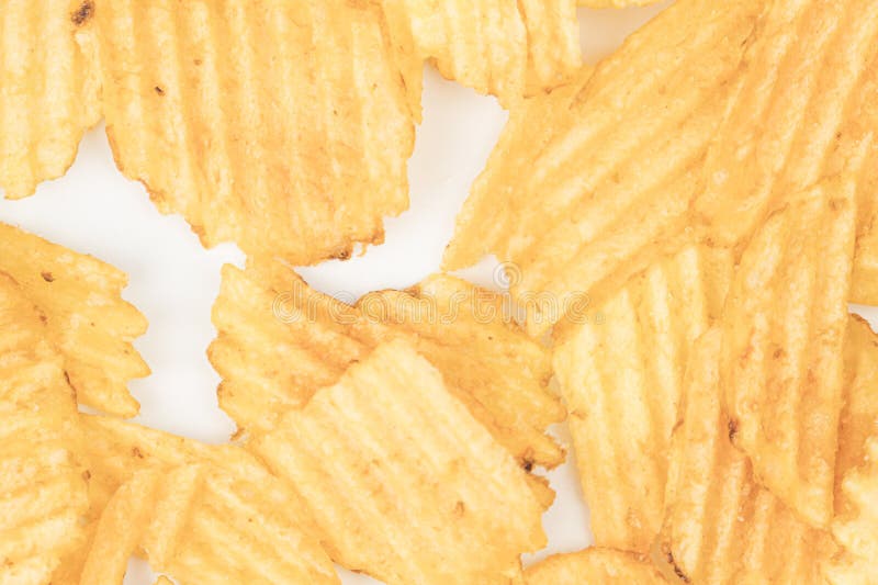 Close-up View of a Pile of Yellow Ruffled Potato Chips on a White ...