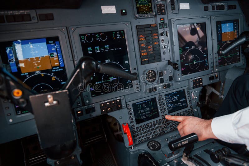 Close Up View. Pilot on the Work in the Passenger Airplane Stock Photo ...
