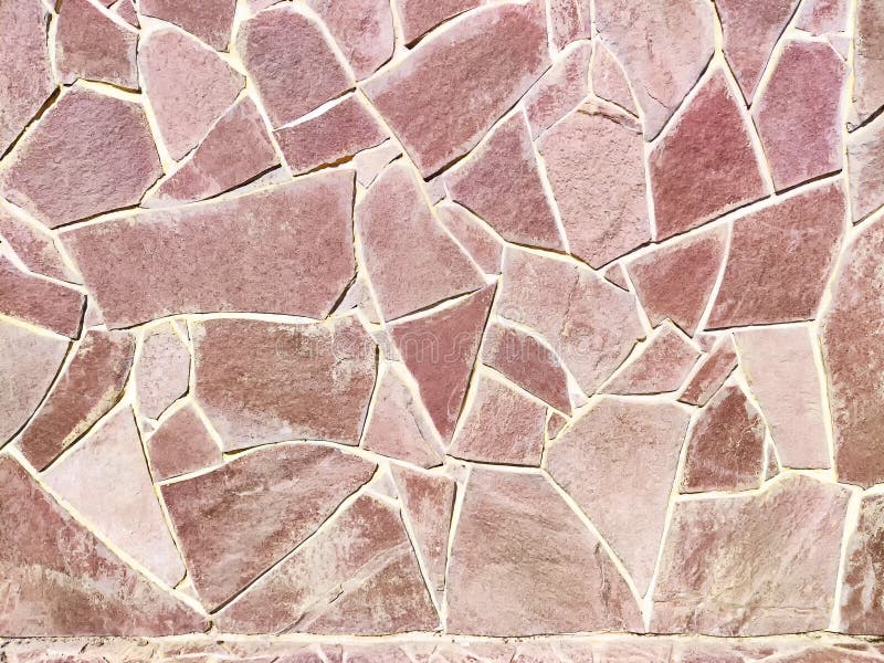 Close-up View of a Pink Stone Wall with an Irregular, Textured Surface ...