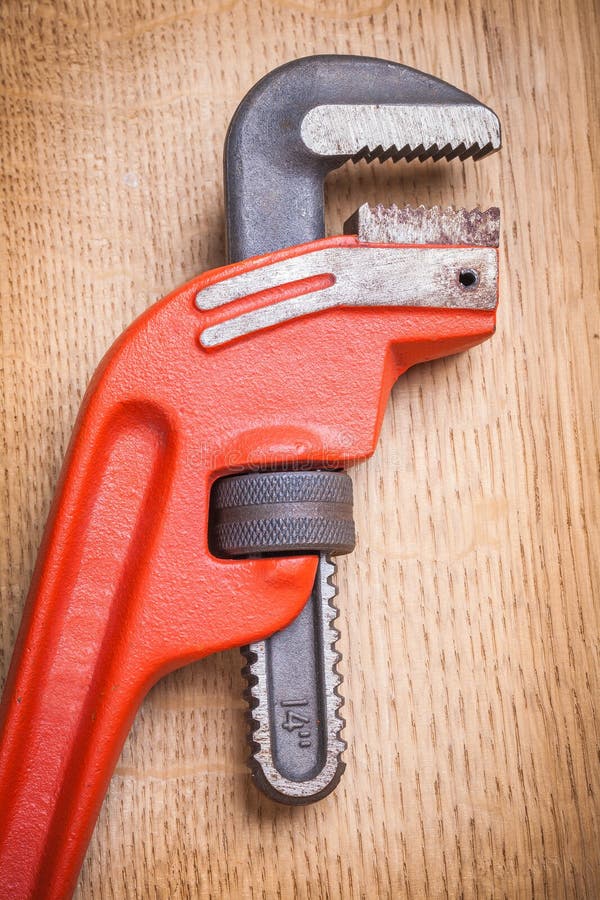 Close Up View on Pipe Wrench on Wooden Board Stock Image - Image of ...