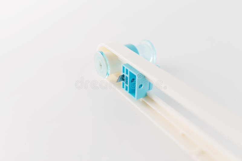 A Close-up View of a Plastic Circle Cutter Device with a Small Blade ...